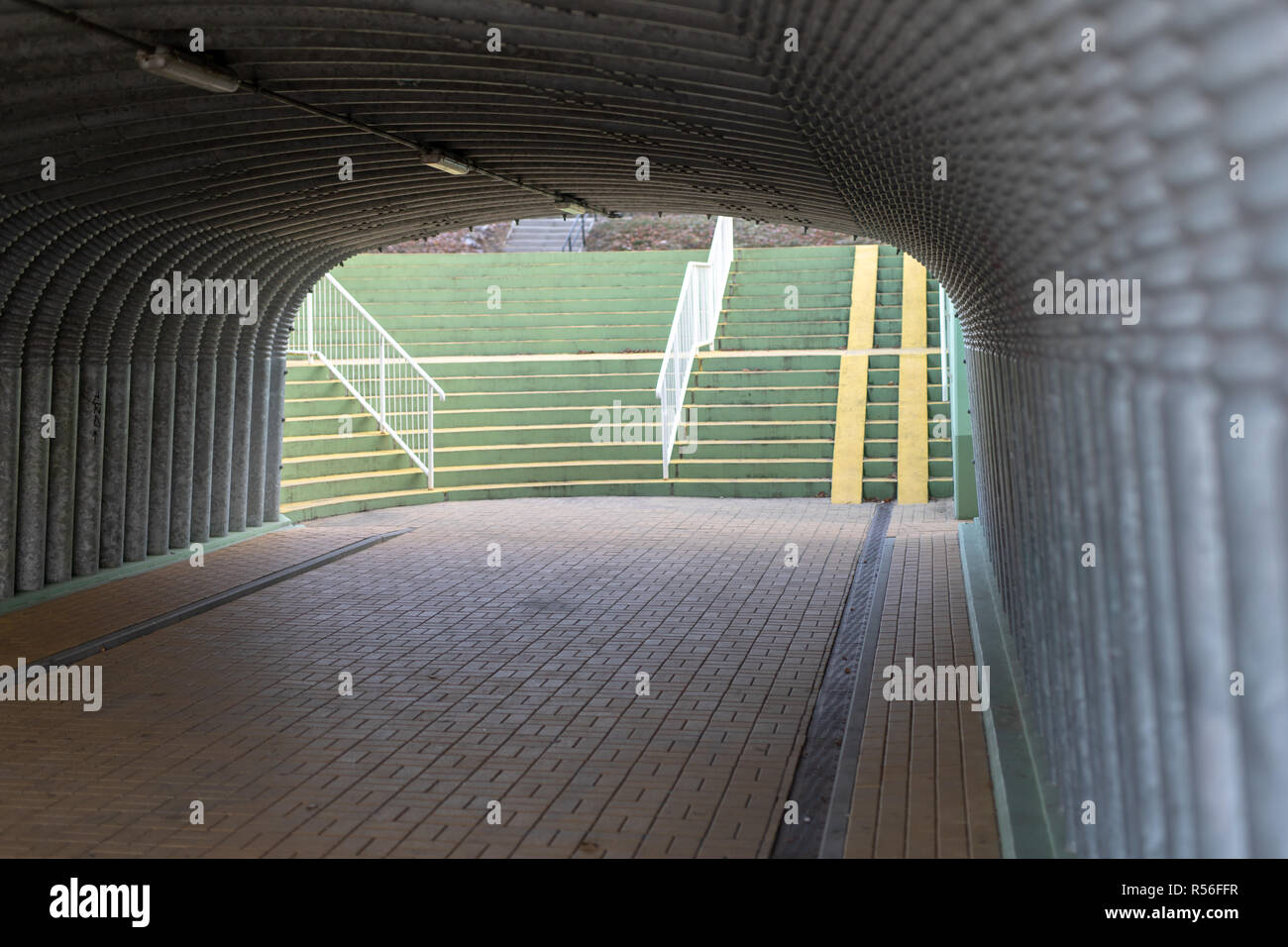 Underpass under a busy road. A place for pedestrians in the tunnel ...