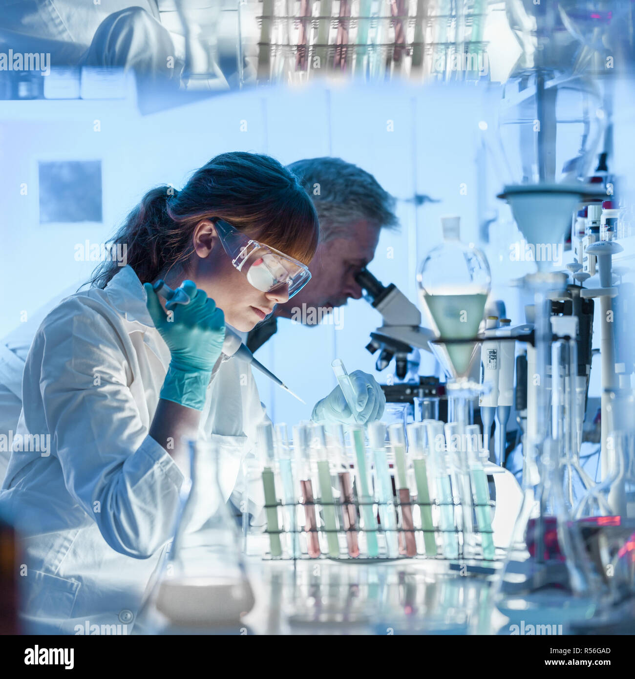 Health care researchers working in scientific laboratory Stock Photo ...