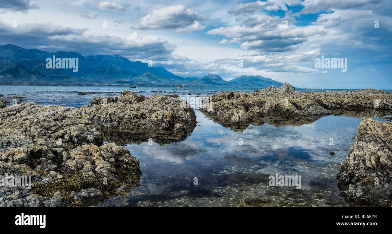 Limestone outcroppings and tidal pools along shoreline of the town of ...