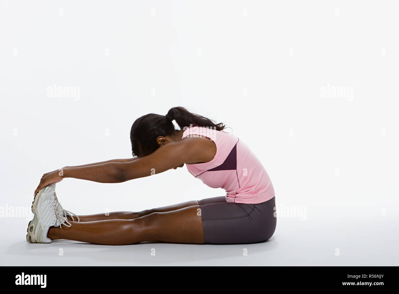 Laughing black woman stretching hi-res stock photography and images - Alamy