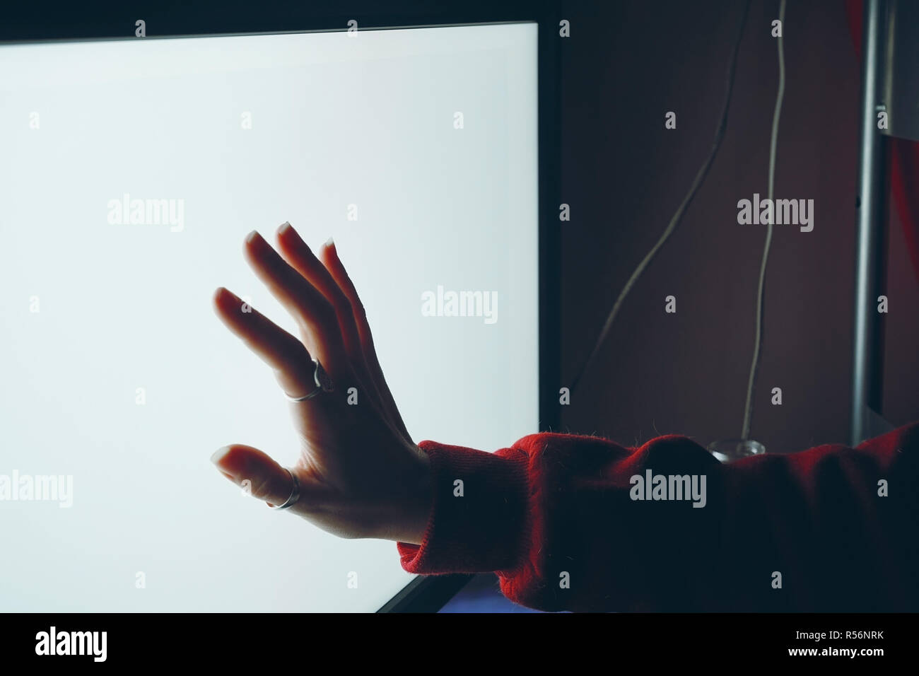 Hand touching a white screen Stock Photo - Alamy
