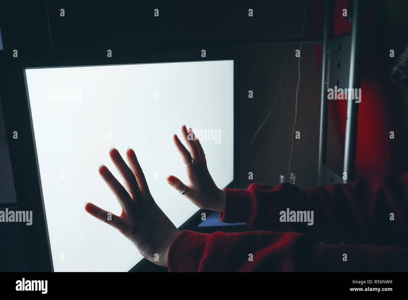 Hand touching a white screen Stock Photo - Alamy