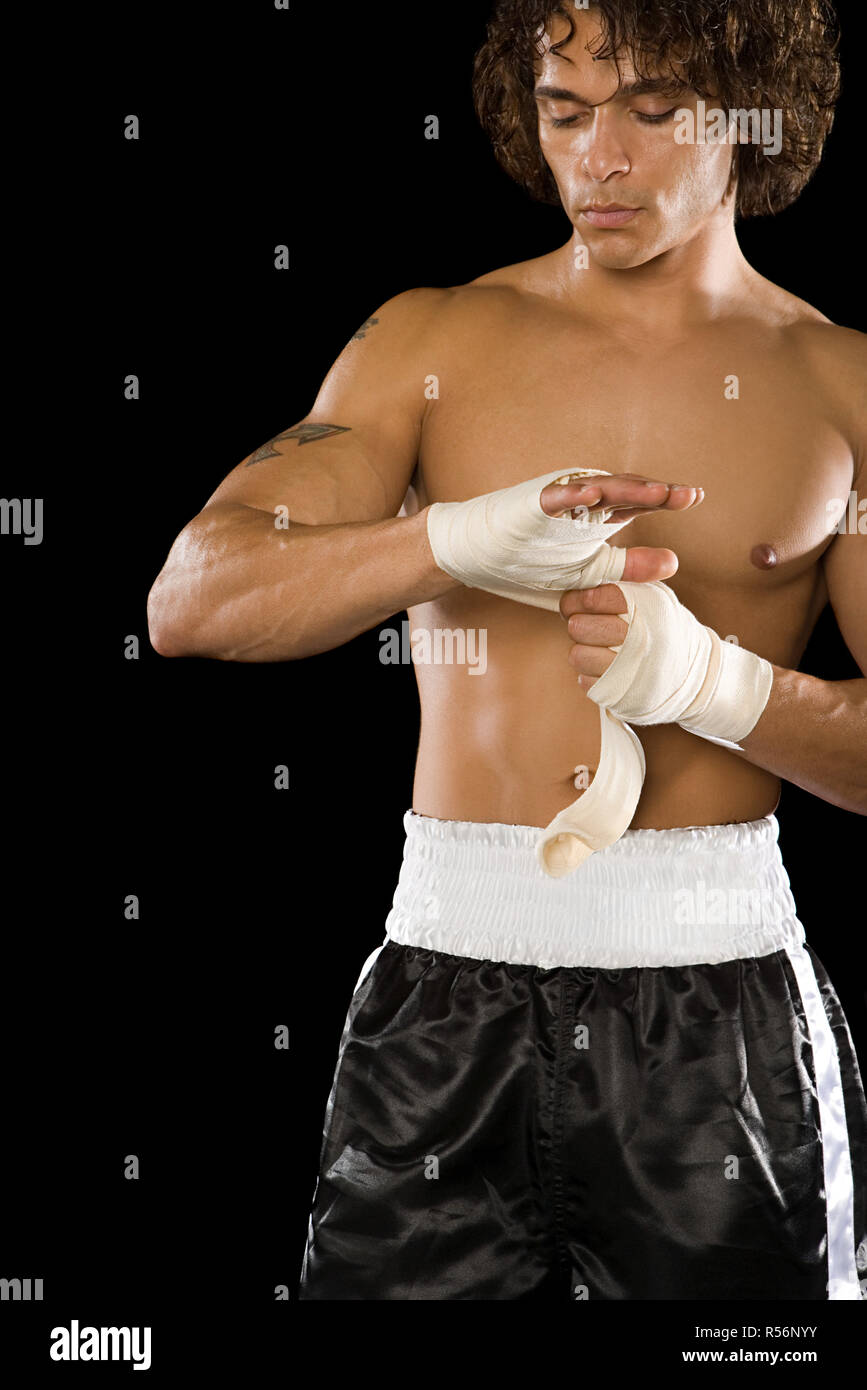Boxer tying bandage Stock Photo - Alamy