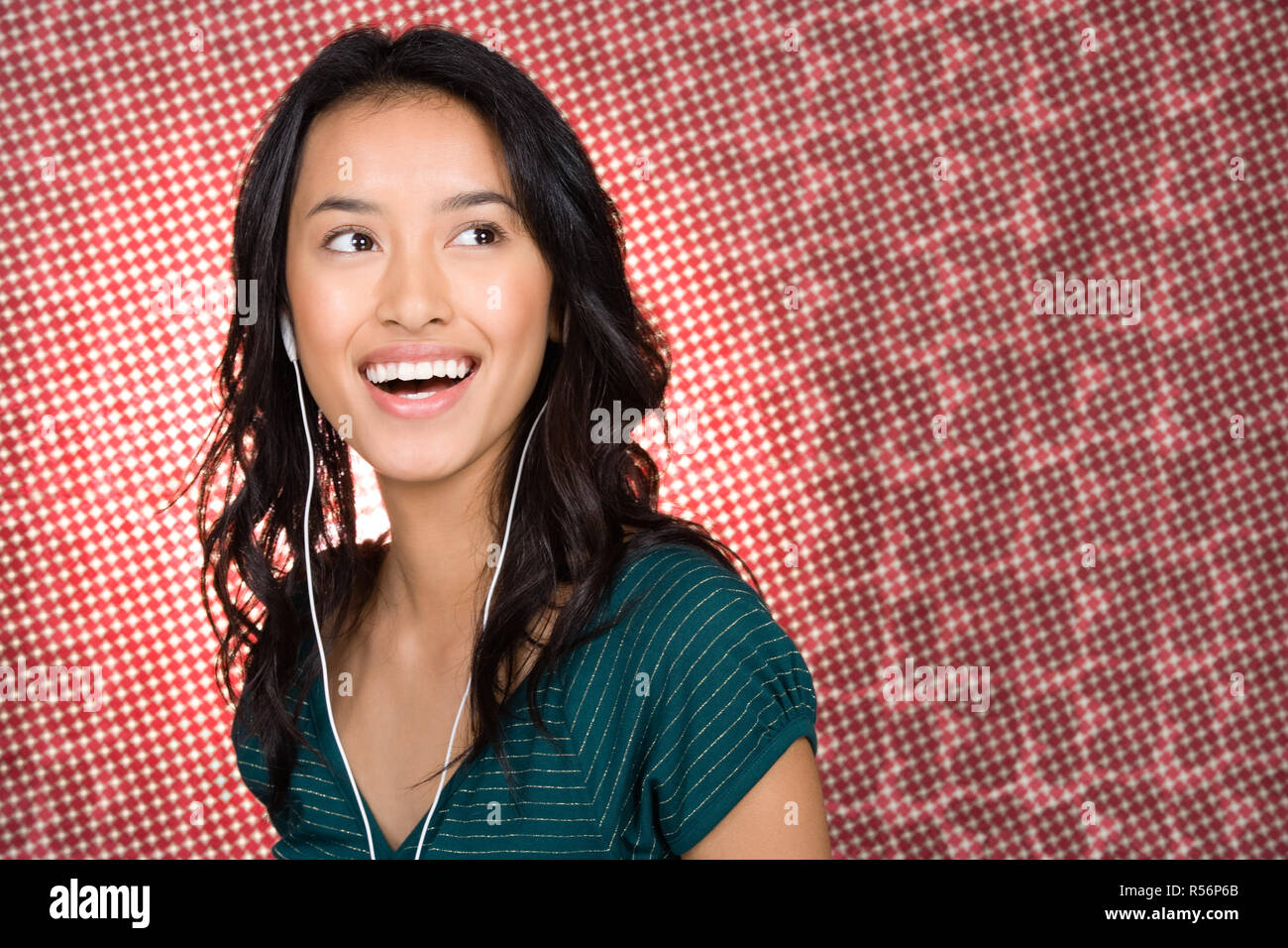 Woman listening to mp3 player Stock Photo - Alamy