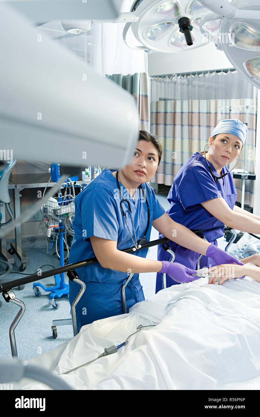 Surgeons with patient Stock Photo - Alamy