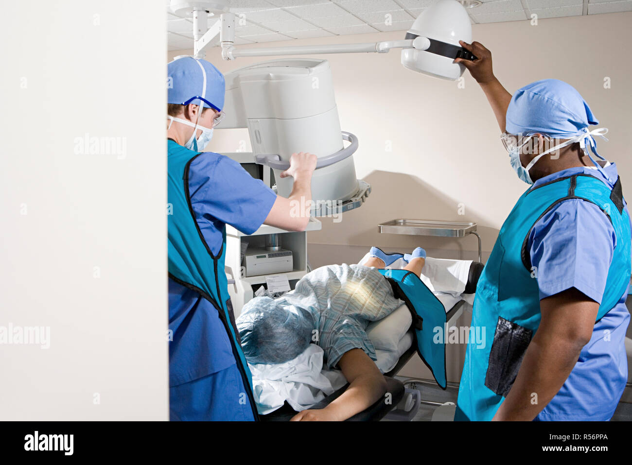 Surgeons with patient Stock Photo - Alamy