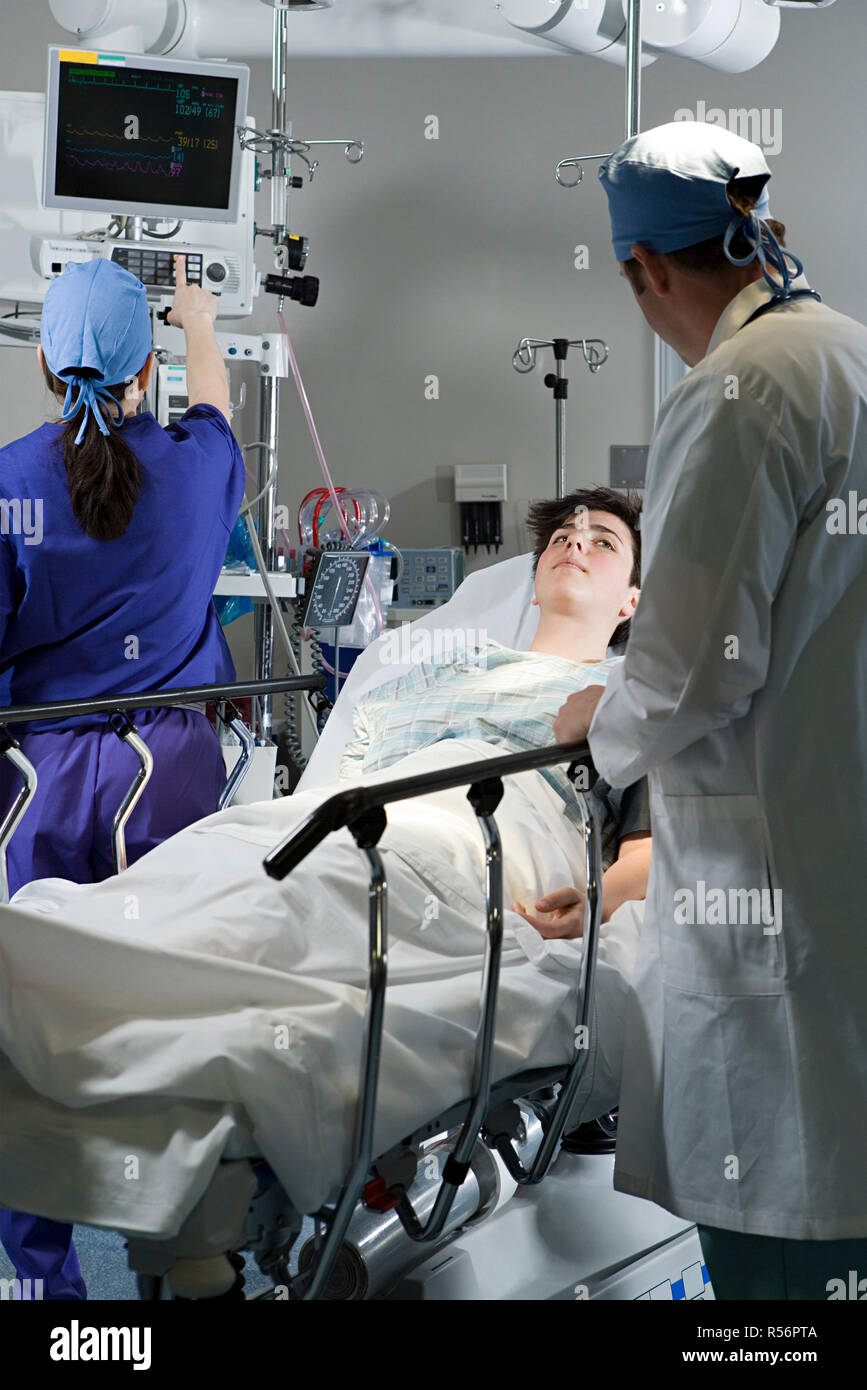 Surgeons with patient Stock Photo - Alamy