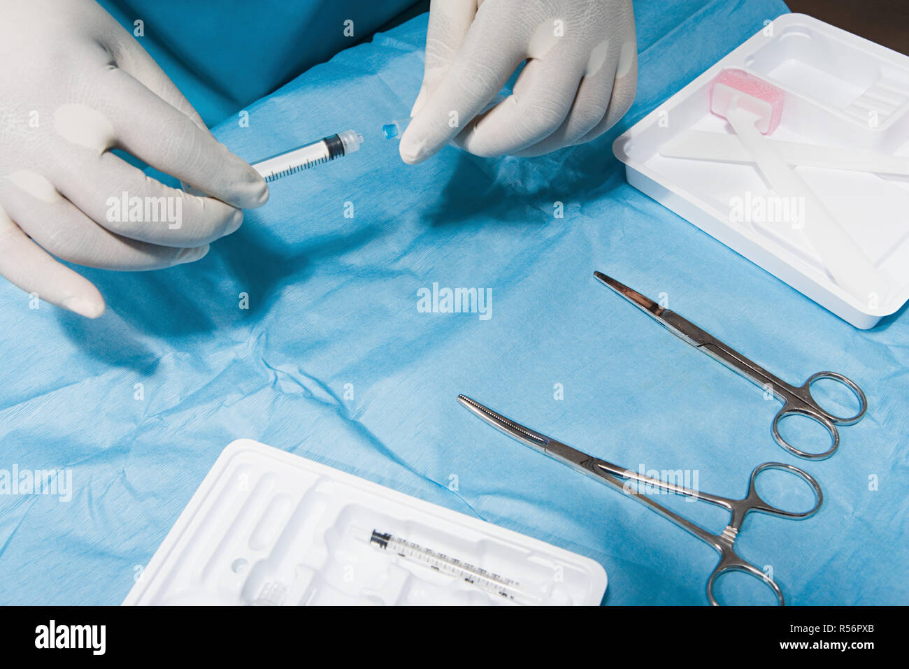 Hands of a surgeon Stock Photo - Alamy