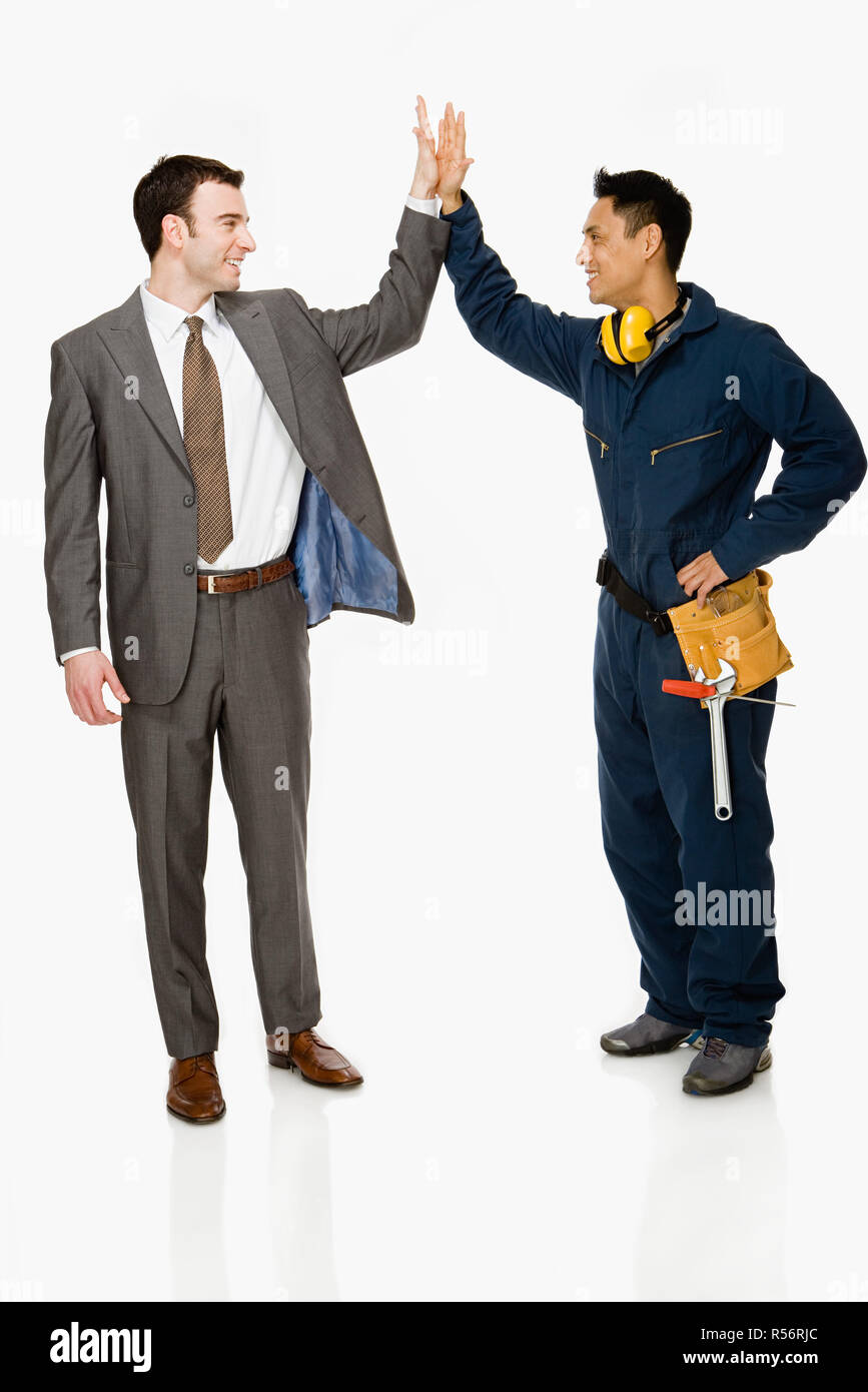 Businessman and workman Stock Photo - Alamy