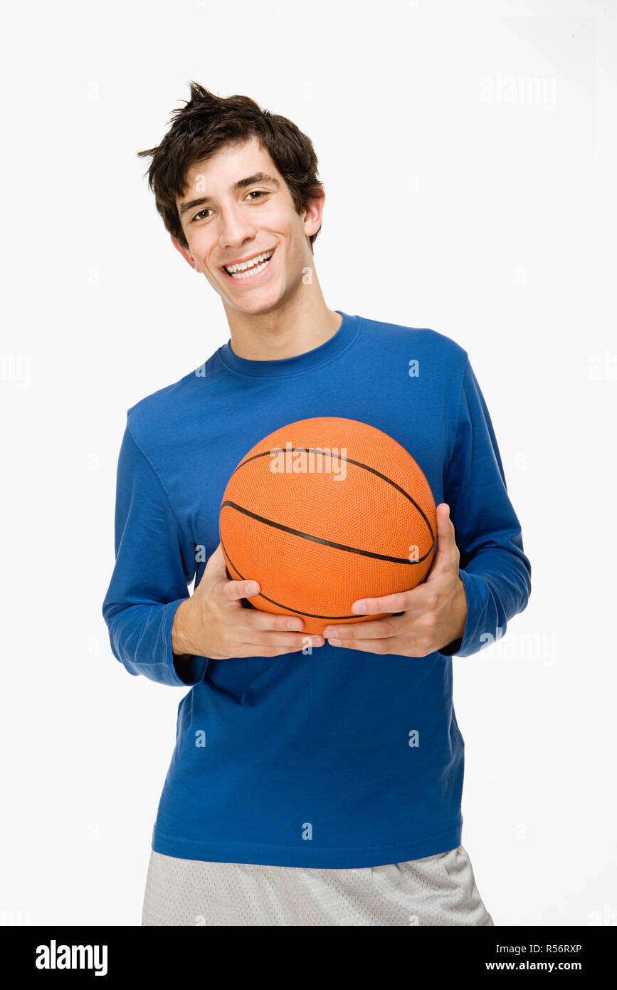 Teenage boy with a basketball Stock Photo - Alamy