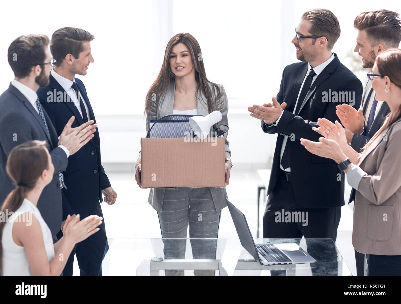 Businesswoman welcomes new company employees hi-res stock photography ...