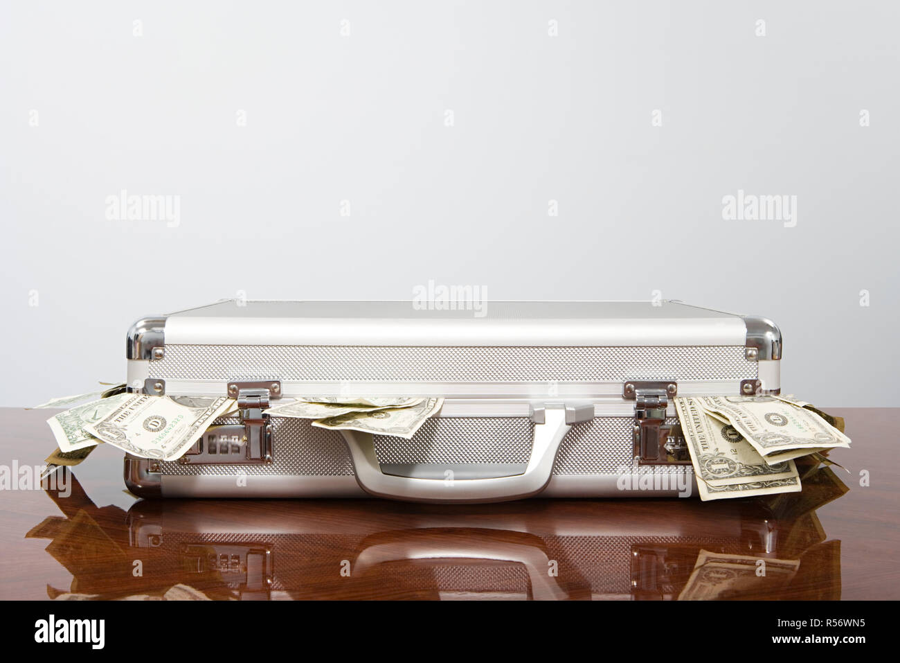 Money in a briefcase Stock Photo - Alamy