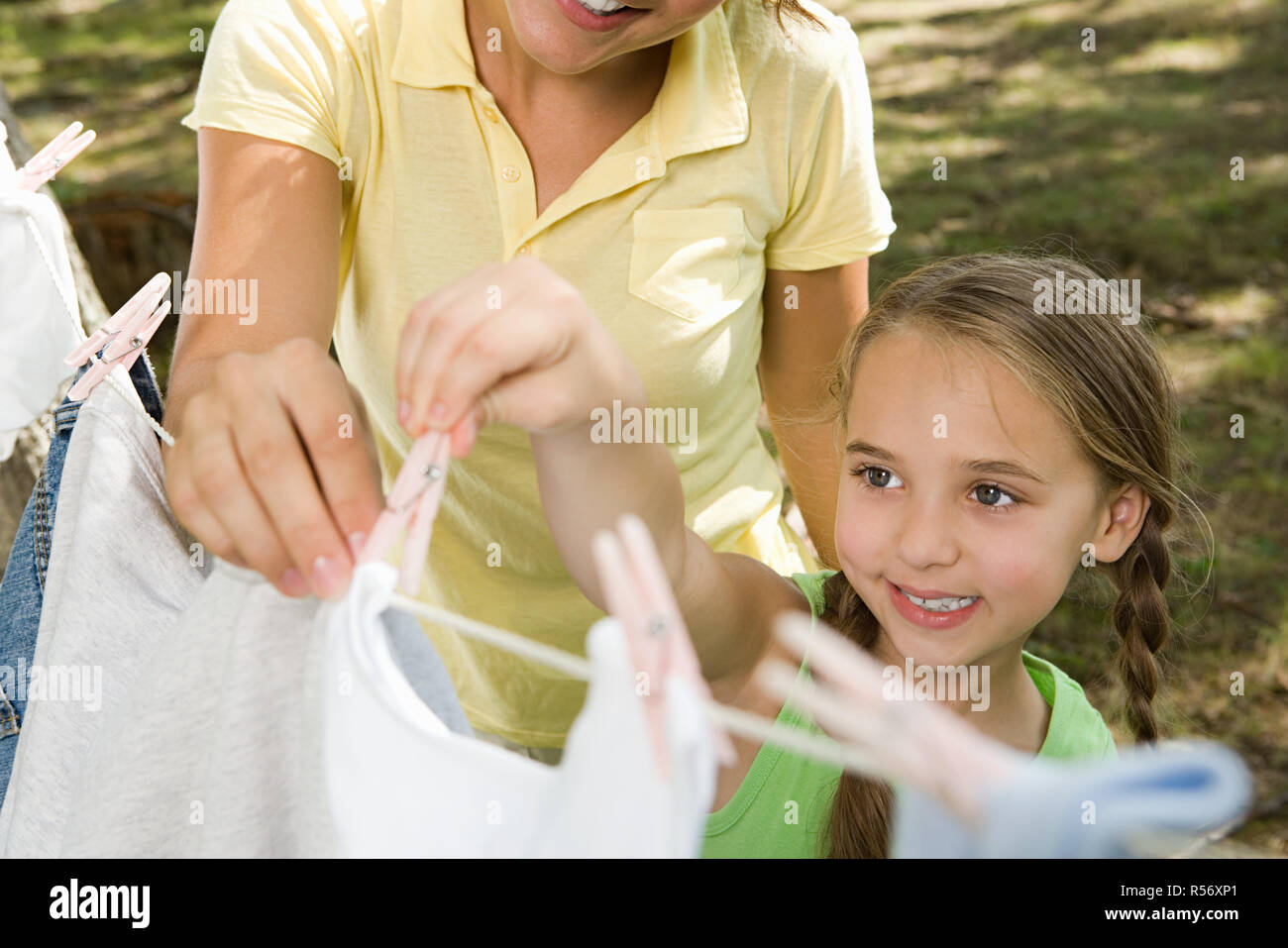 Girl hanging washing out hi-res stock photography and images - Alamy