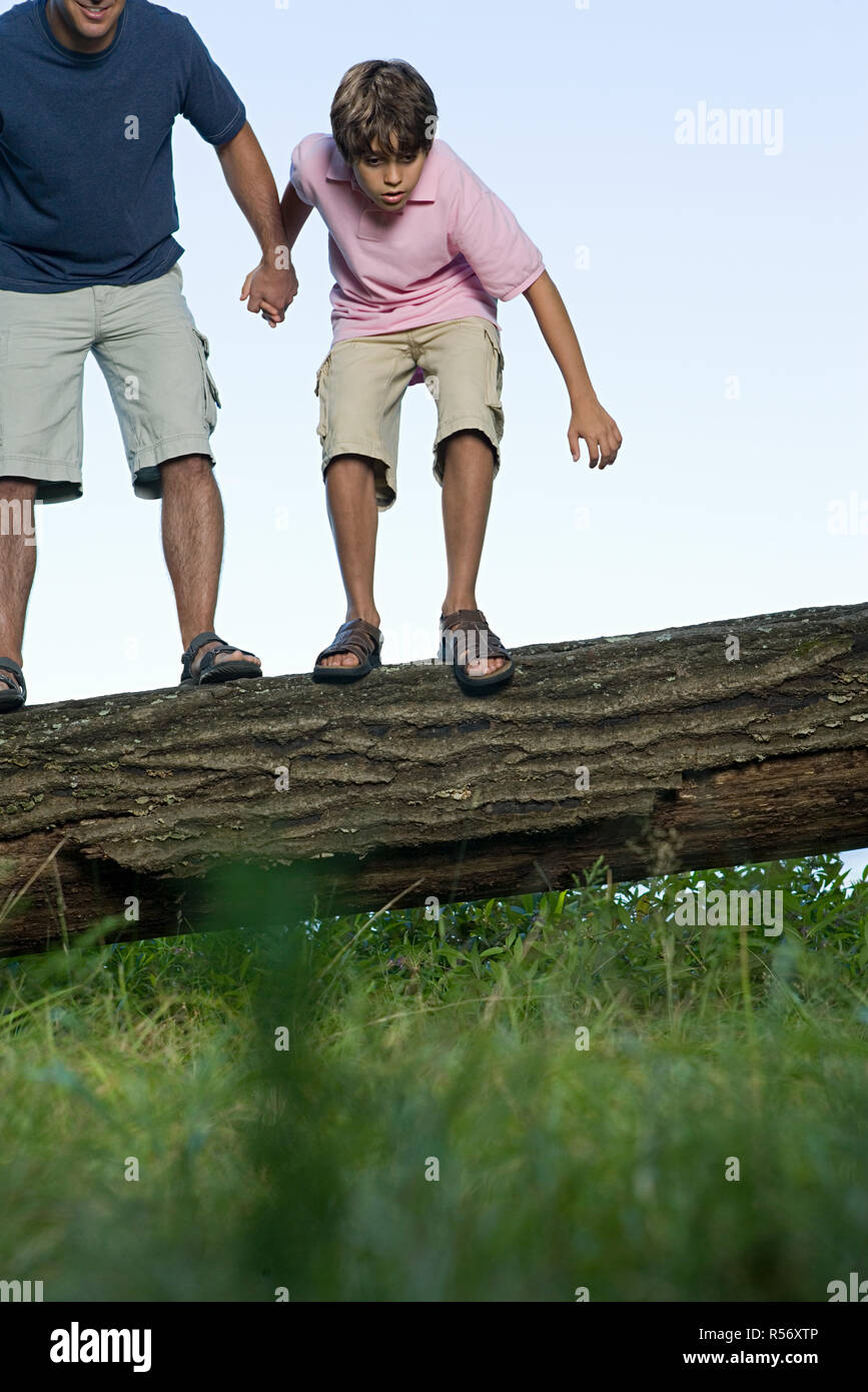 Boy looking at ground in awe Stock Photo - Alamy