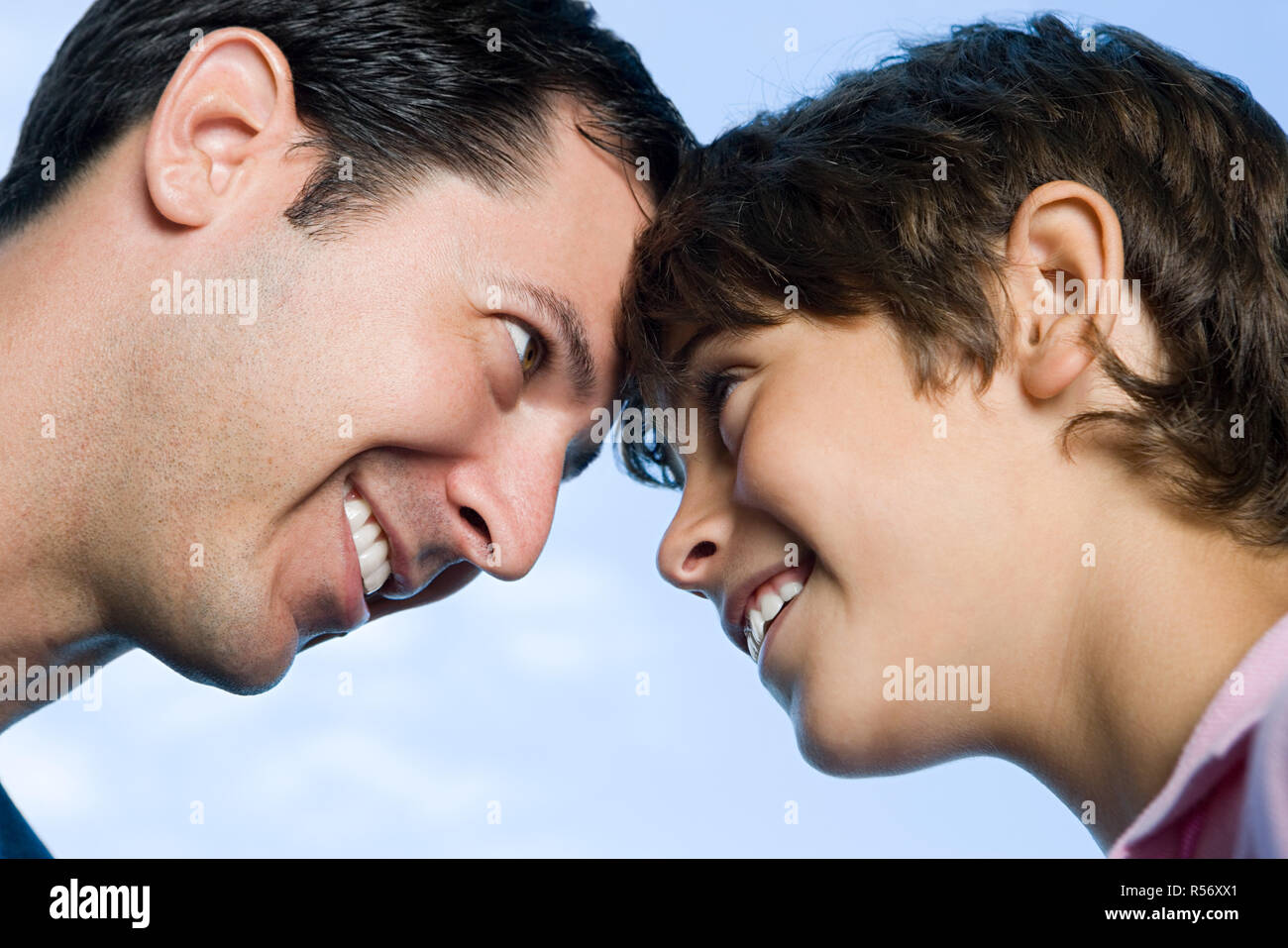 Father and son face to face Stock Photo - Alamy