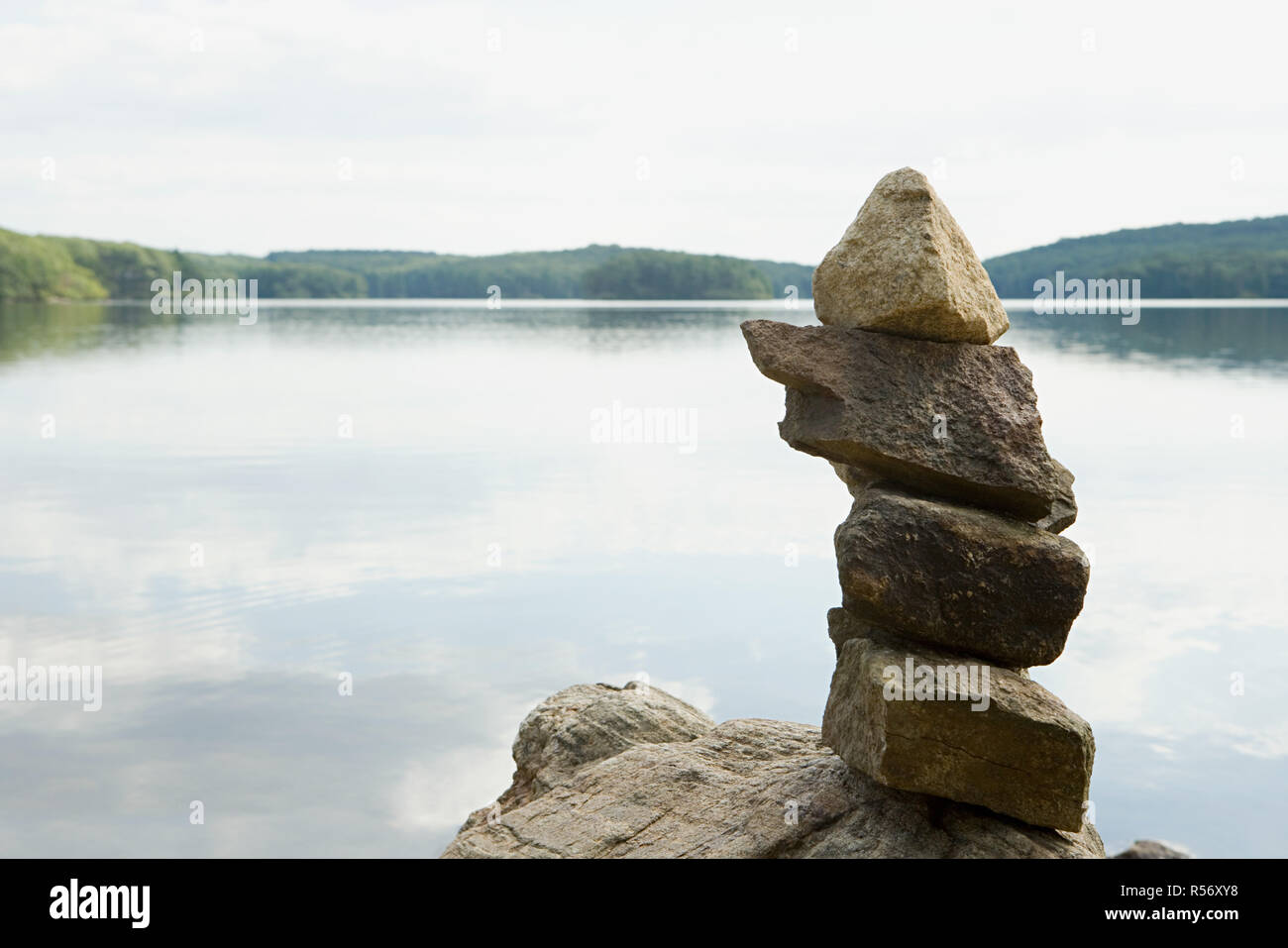 Pile of rocks by a lake Stock Photo - Alamy
