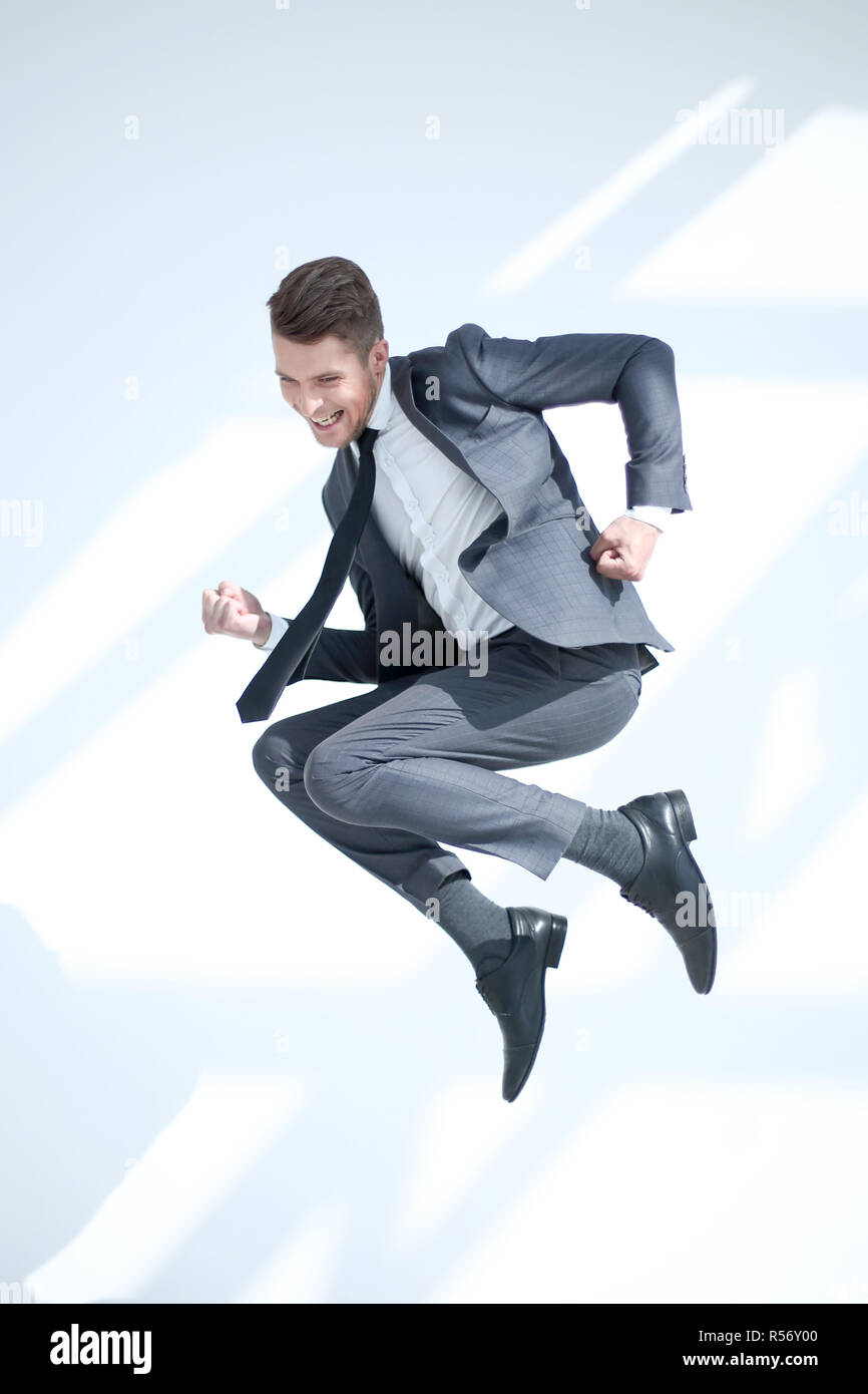 Full-length jump of a young man jumping with an open mouth, isol Stock ...