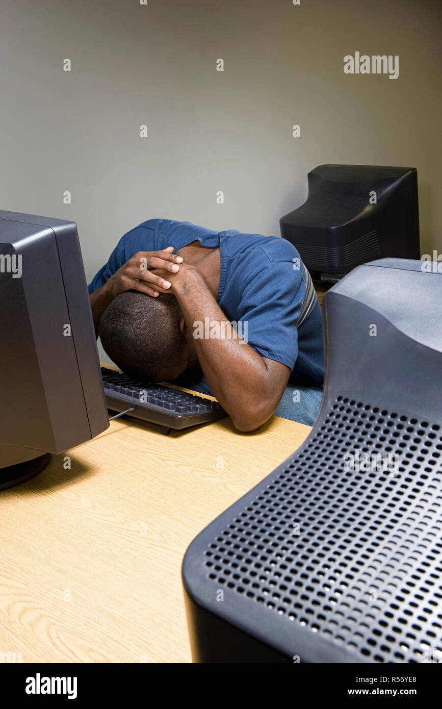 Male student sleeping at his computer Stock Photo - Alamy