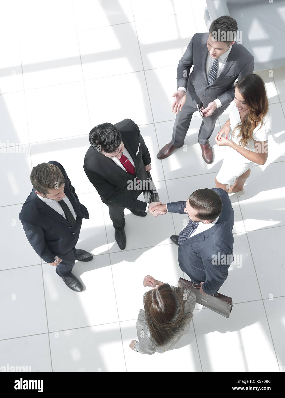top view. handshake business partners at the meeting Stock Photo - Alamy