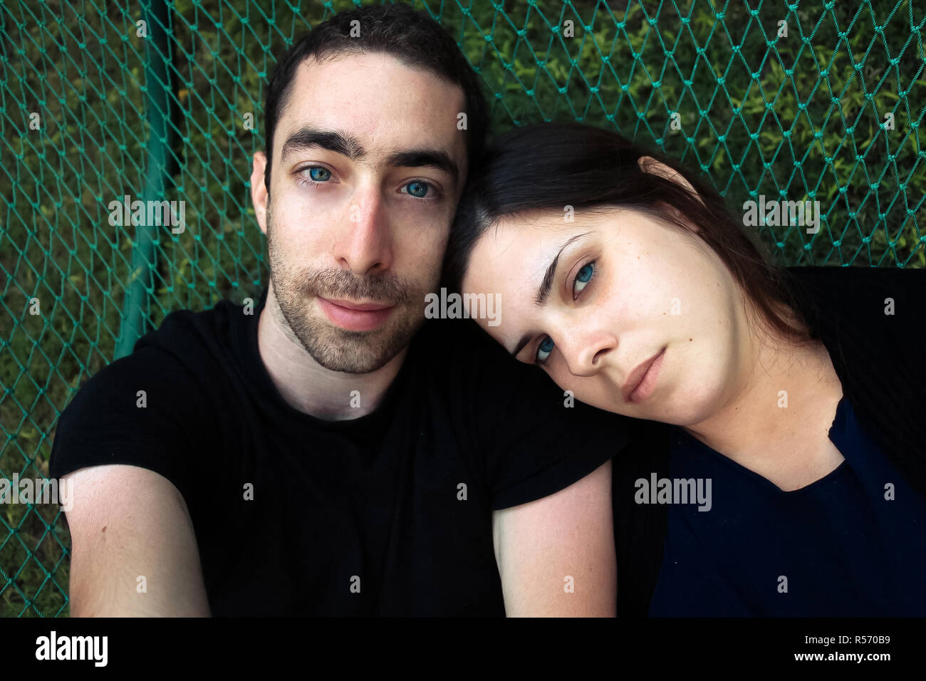 Couple cuddling hammock hi-res stock photography and images - Alamy