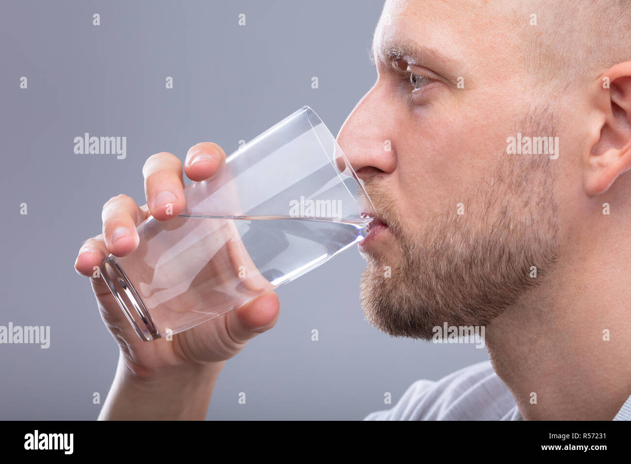 Close-up Of A Man Drinking Glass Of Water Stock Photo - Alamy