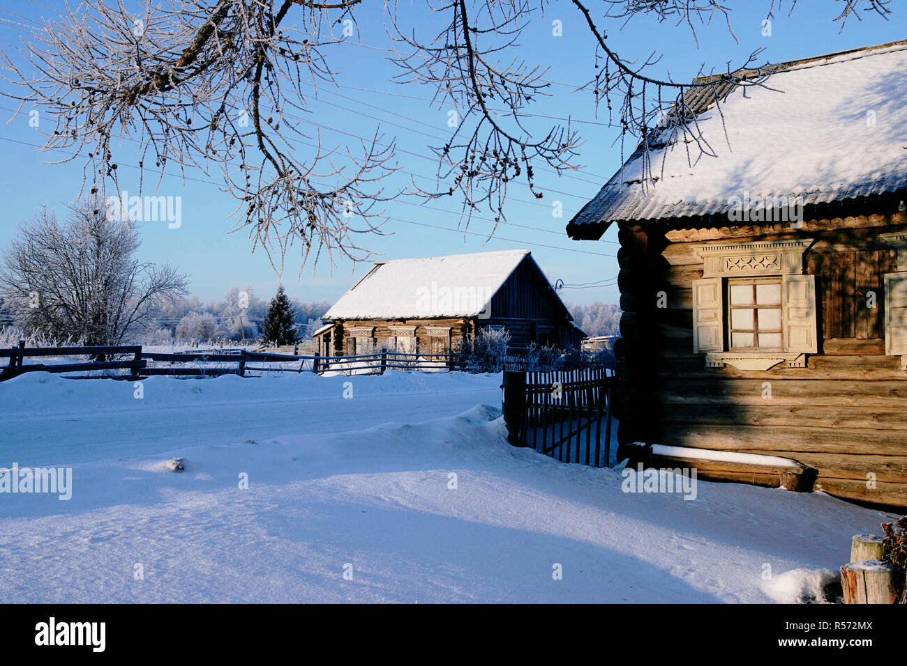 winter landscape with wooden houses in deep snow Stock Photo - Alamy