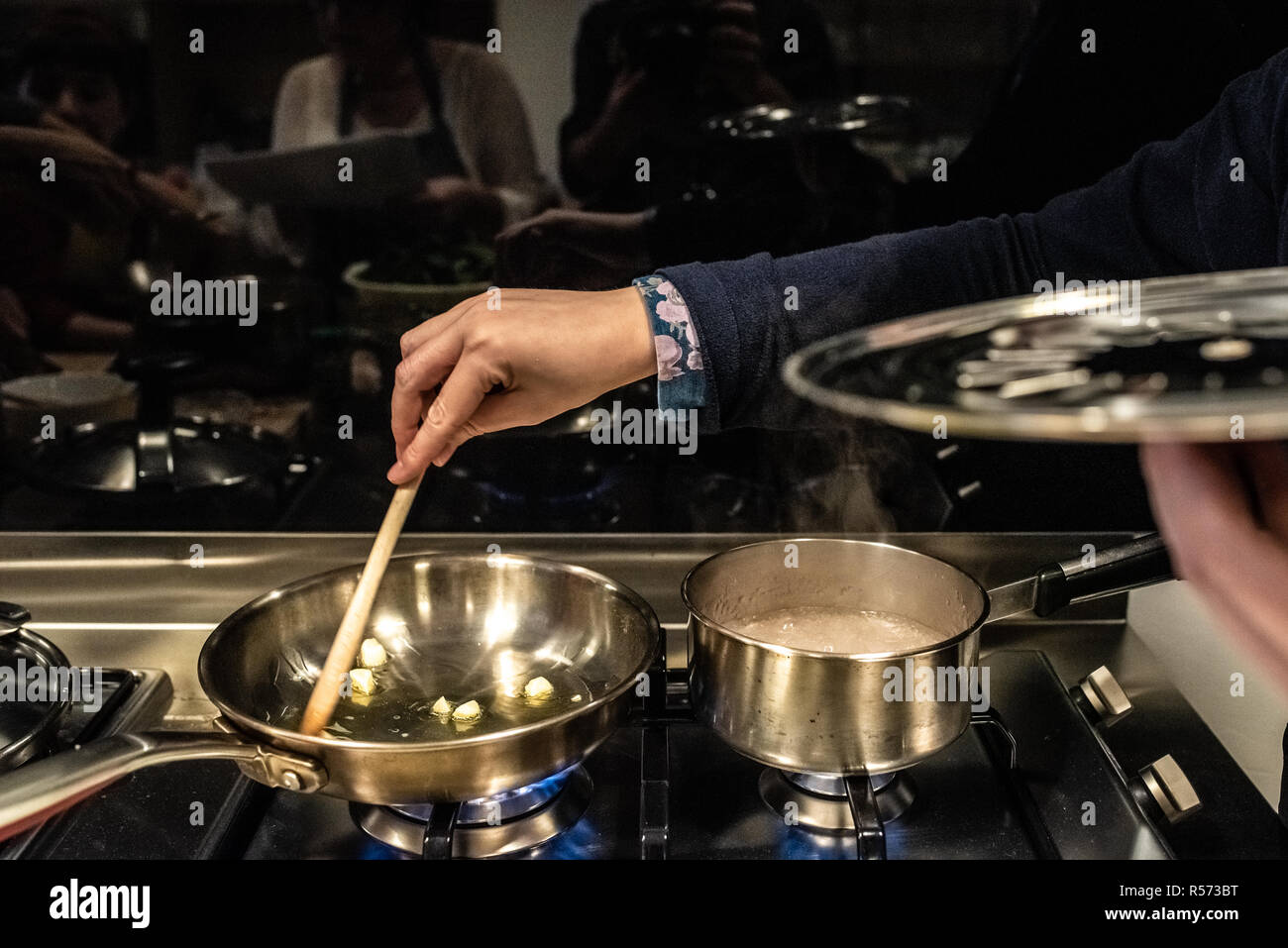 Chef stirring a stew in the pot Stock Photo - Alamy
