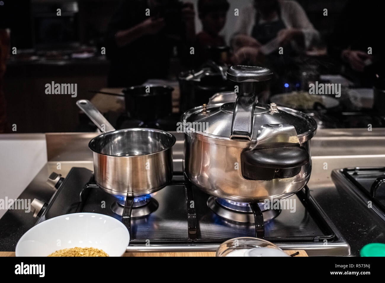 Kitchen cookware with large pots on fire Stock Photo - Alamy