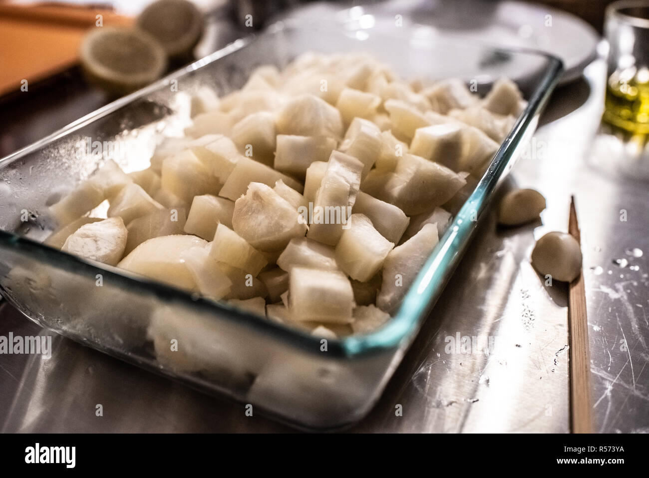 Yucca cut into cubes for frying Stock Photo - Alamy