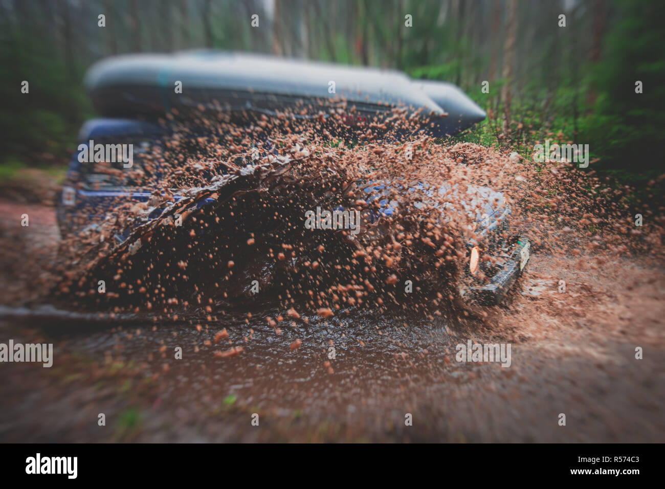 Suv offroad 4wd car rides through muddy puddle, off-road track road ...