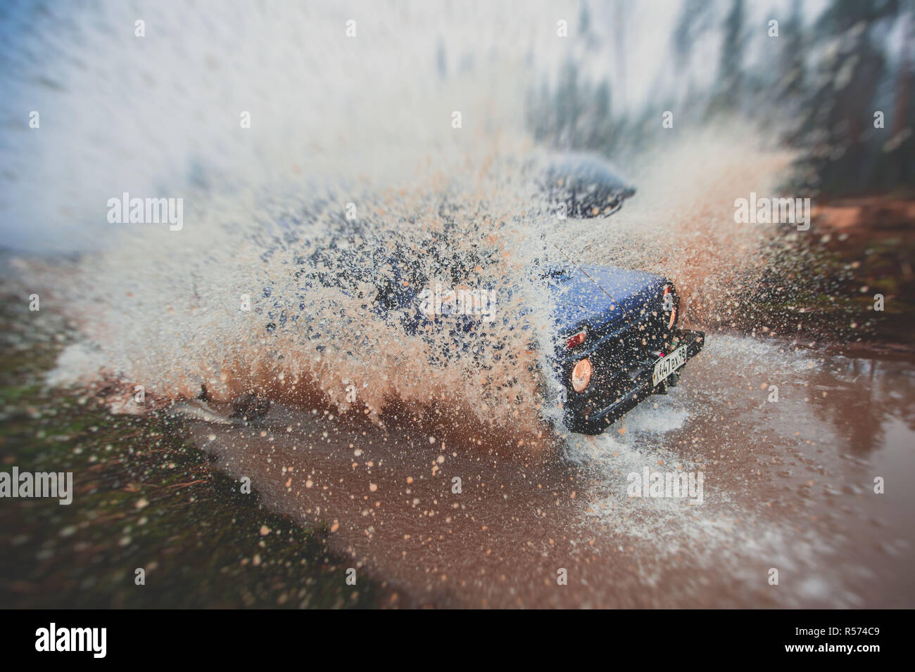 Suv offroad 4wd car rides through muddy puddle, off-road track road ...