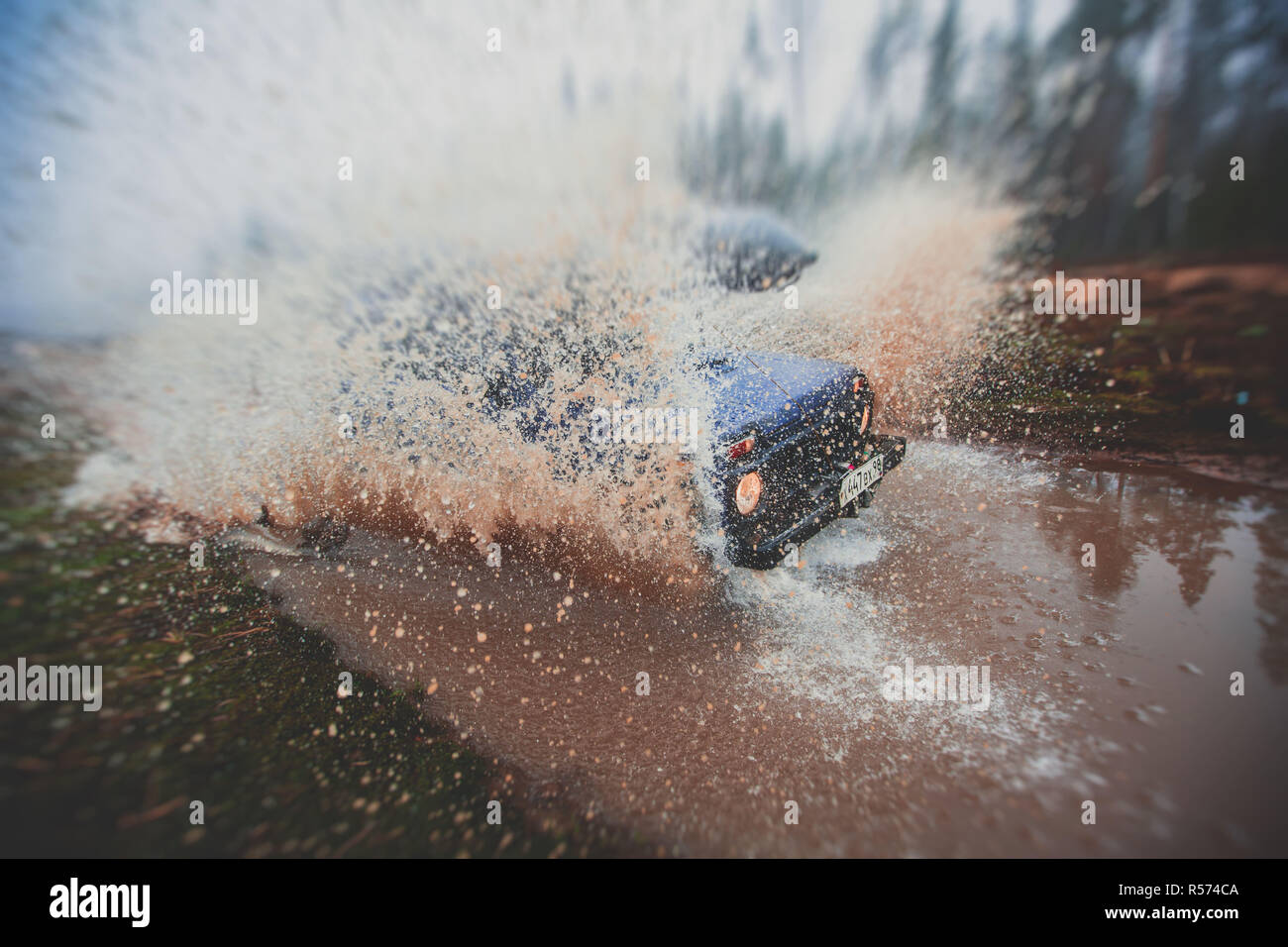 Suv offroad 4wd car rides through muddy puddle, off-road track road ...