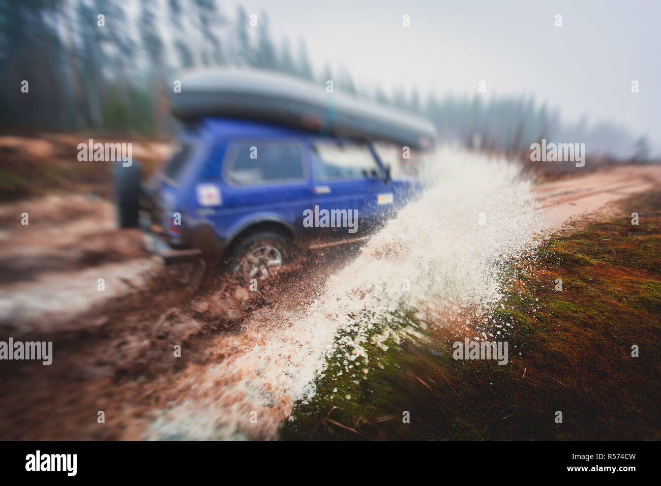 Suv offroad 4wd car rides through muddy puddle, off-road track road ...