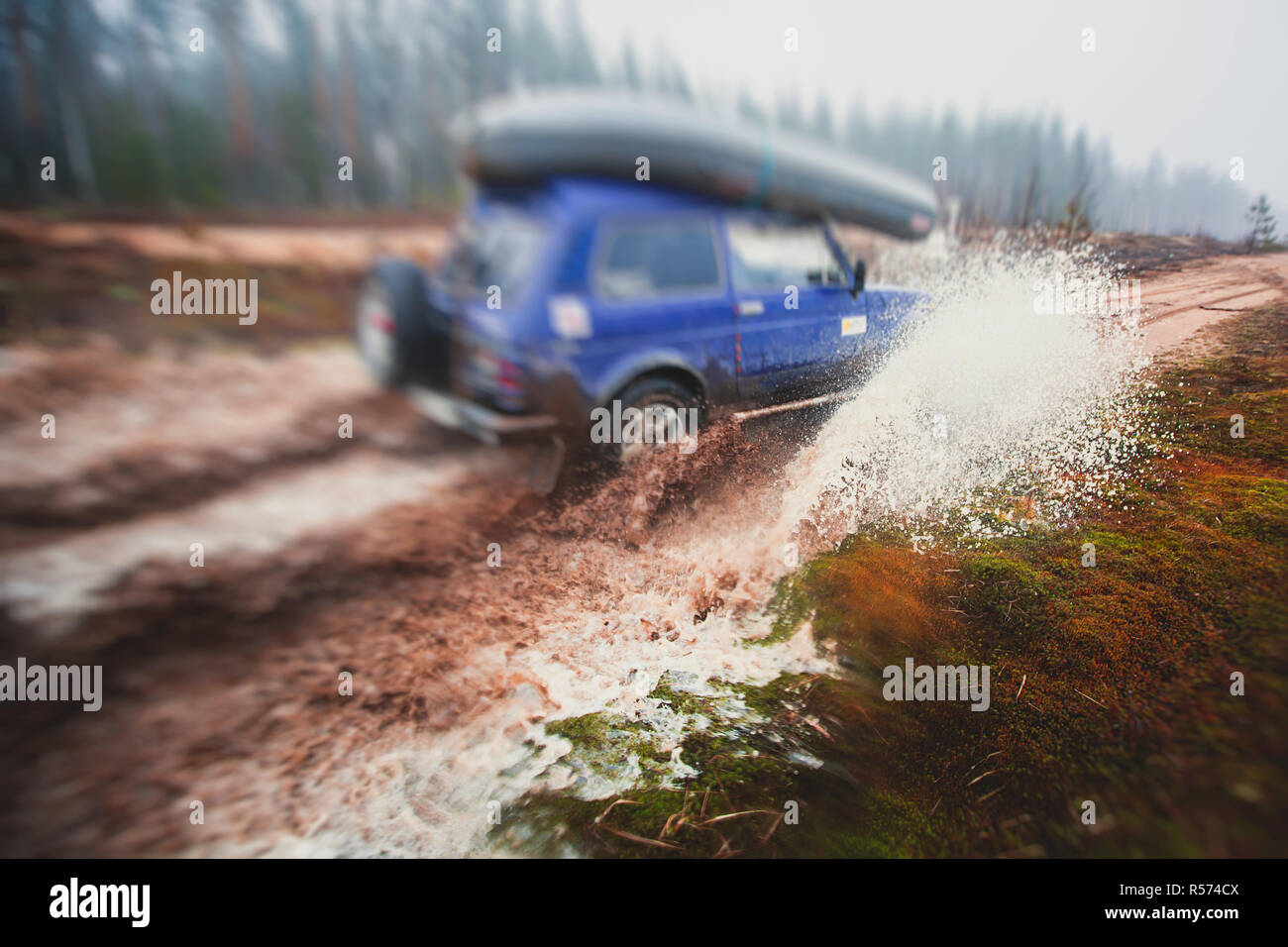 Suv offroad 4wd car rides through muddy puddle, off-road track road ...