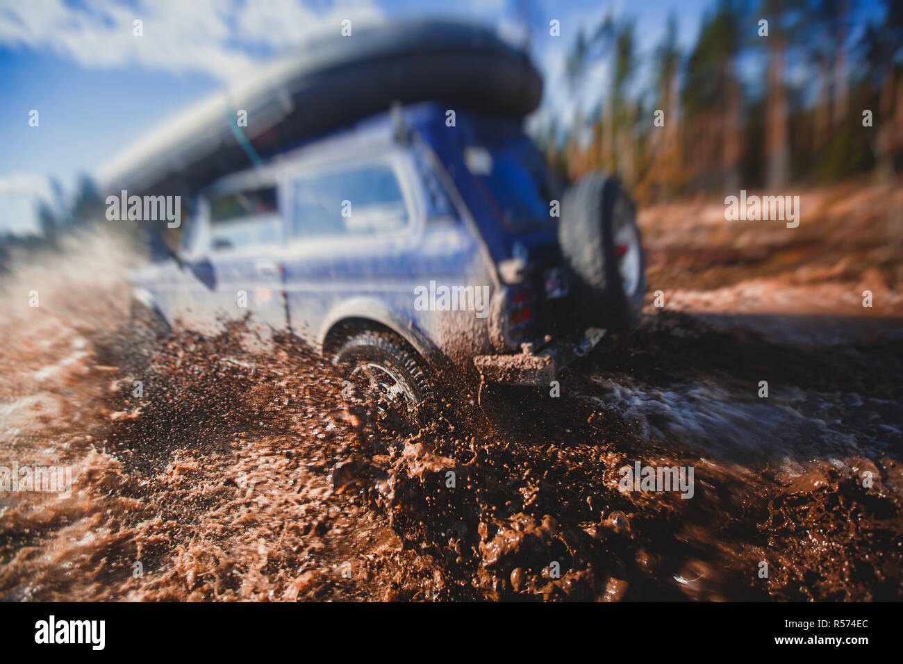 Suv offroad 4wd car rides through muddy puddle, off-road track road ...