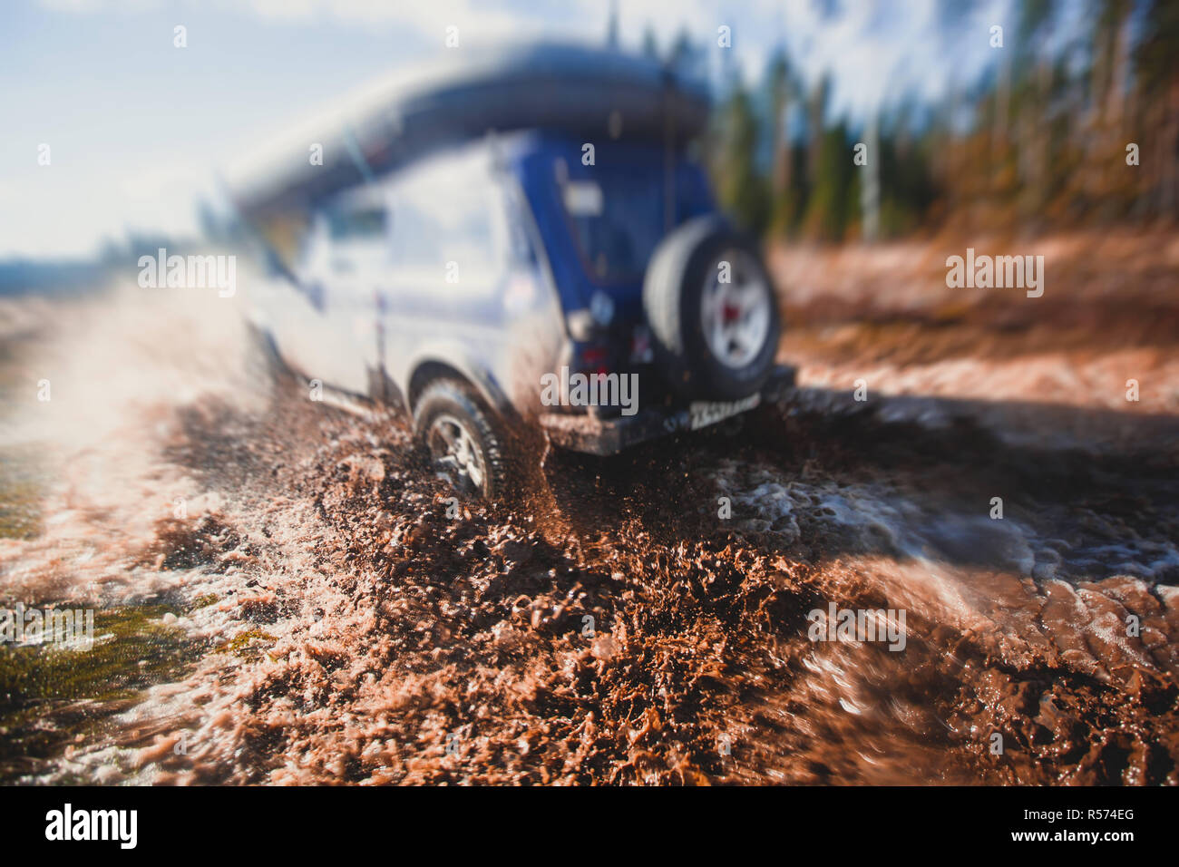 Suv offroad 4wd car rides through muddy puddle, off-road track road ...