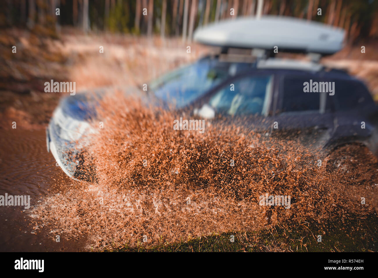 Suv offroad 4wd car rides through muddy puddle, off-road track road ...