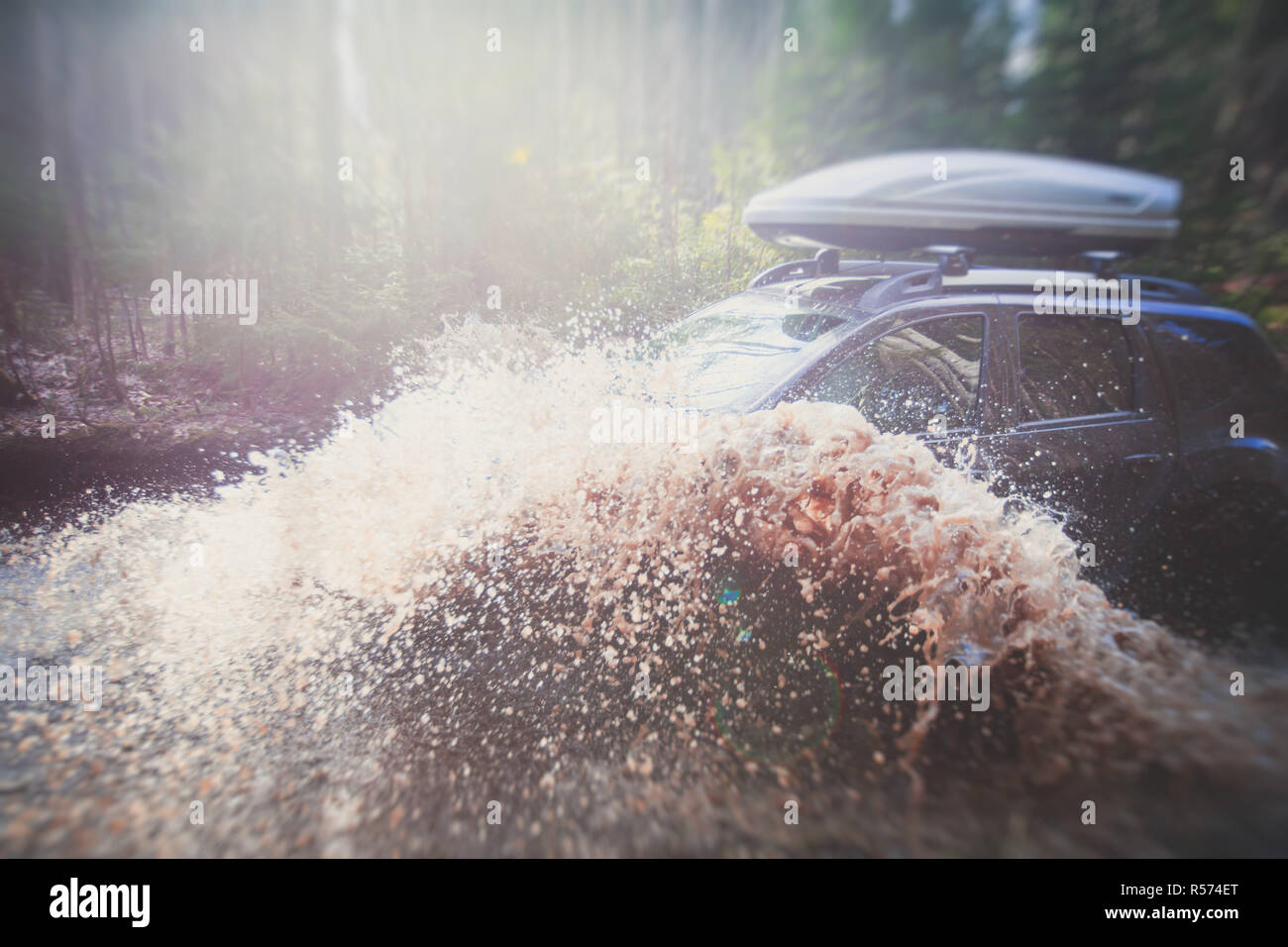 Suv offroad 4wd car rides through muddy puddle, off-road track road ...