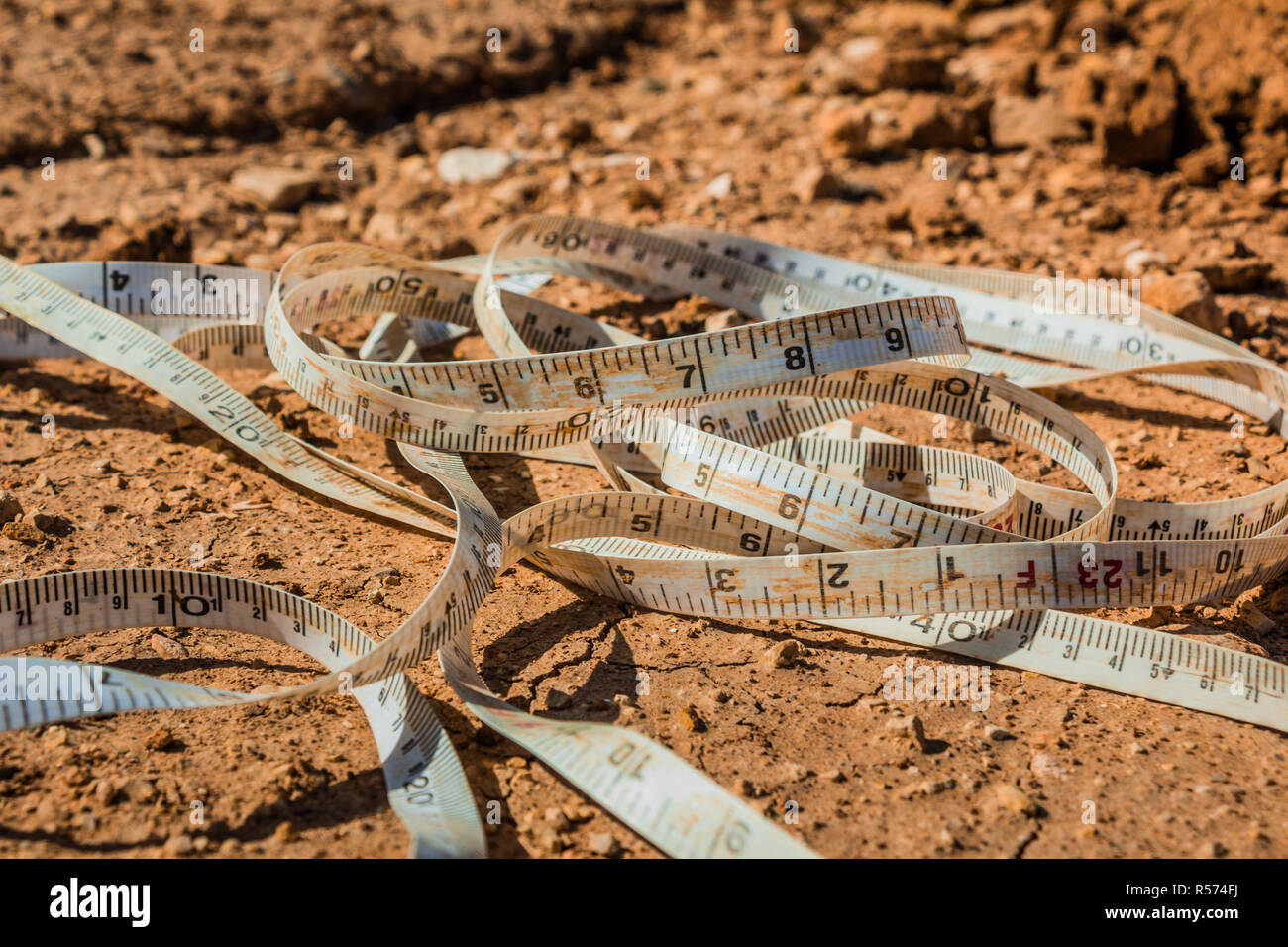 Measuring tape placed on the ground at a construction site Stock Photo ...