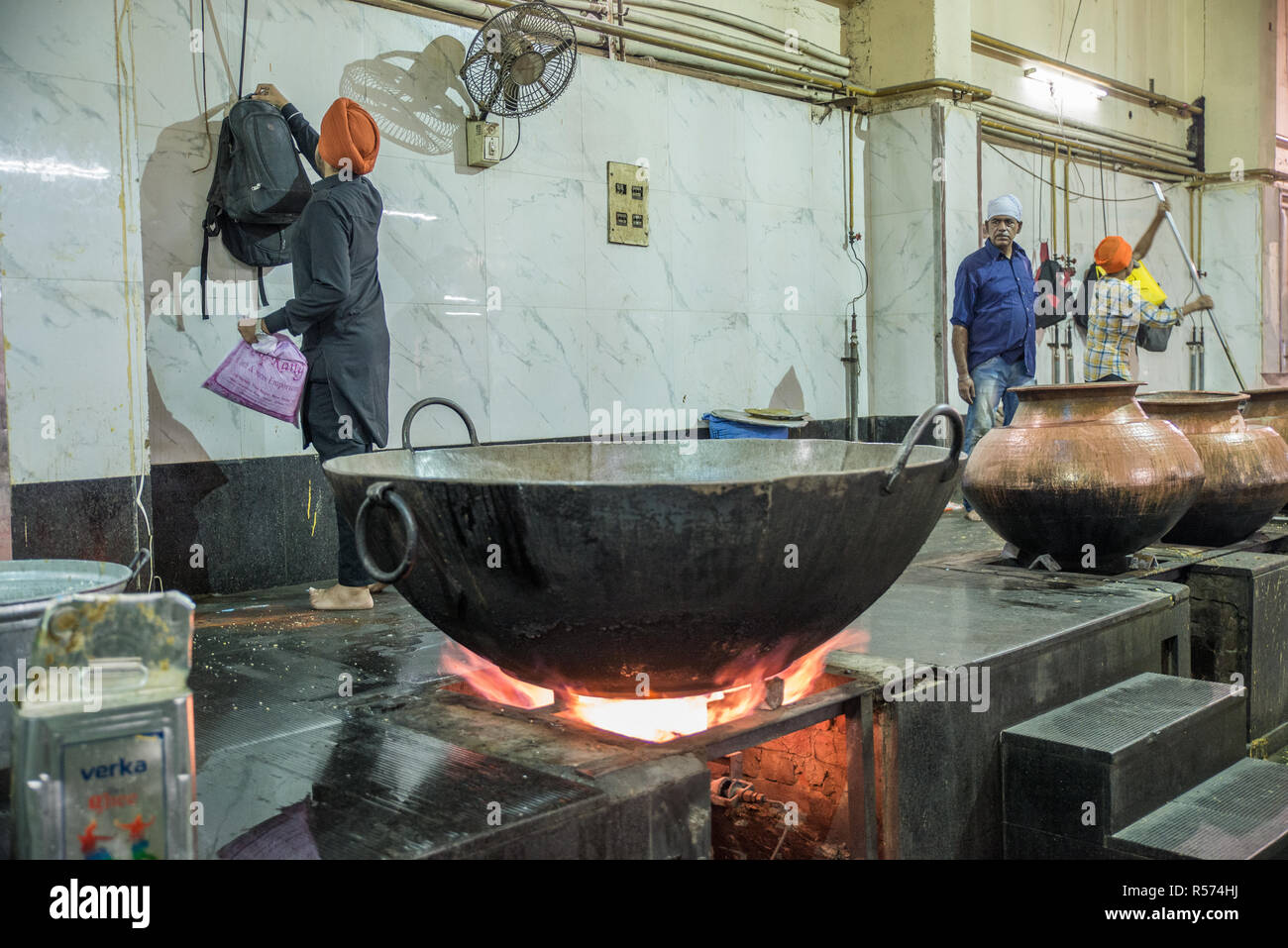 Volunteers preparing langar (free food) at Gurudwara Bangla Sahib Sikh ...