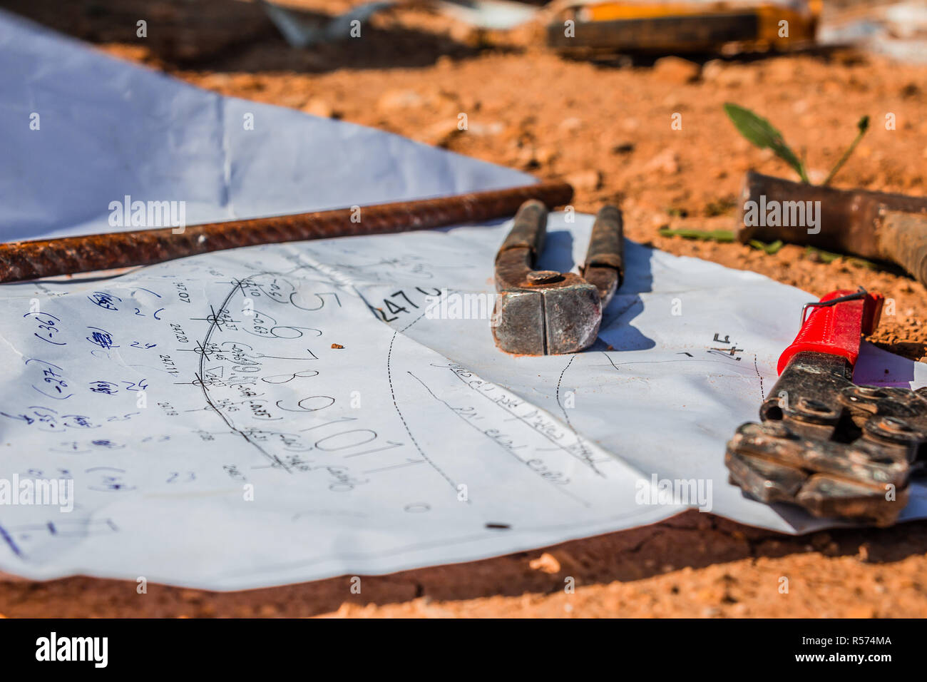 Construction plan and tools laid on the ground Stock Photo - Alamy