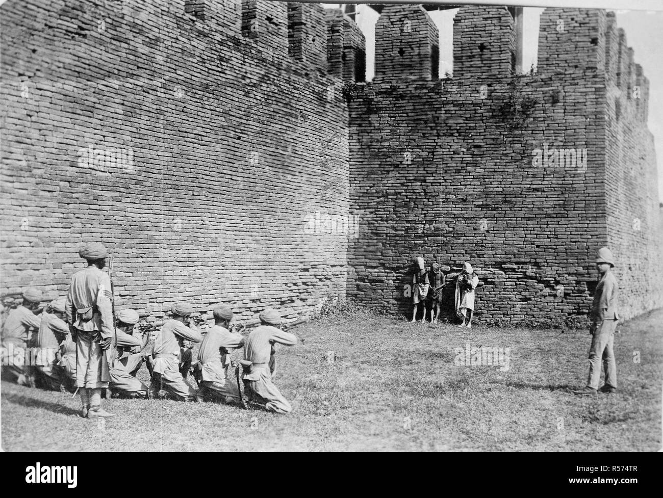 Execution of Burmese dacoits at Mandalay. A glass copy negative of a ...