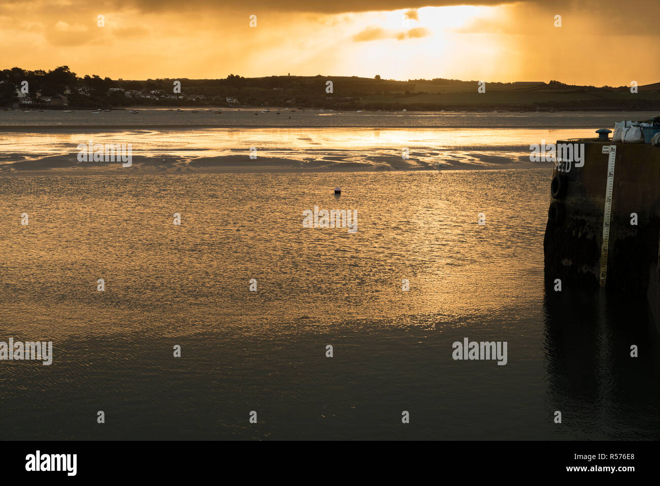 Dramatic early morning sun looking across the Camel Estuary to Rock ...