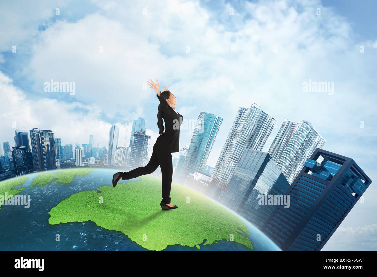 Happy asian business woman running on big earth Stock Photo - Alamy