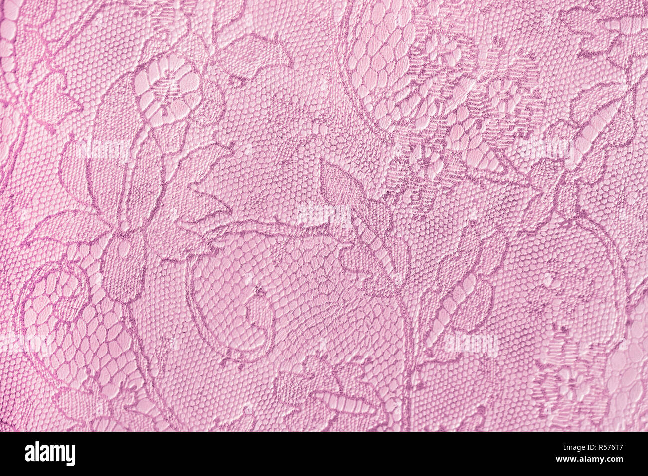 Texture of tender pink genuine leather close-up, with embossed floral ...