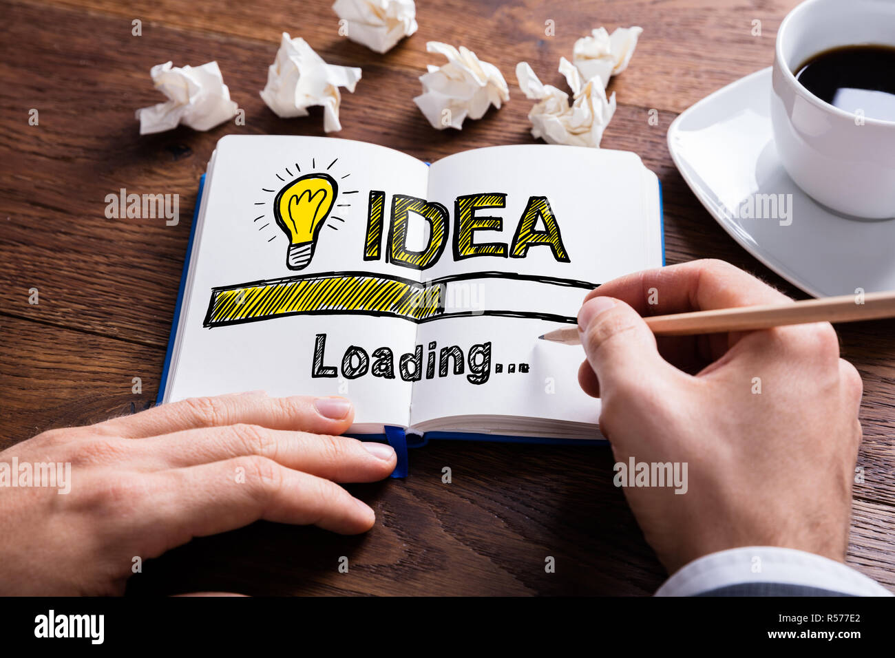 Businessperson Drawing Idea Concept On Notebook Stock Photo - Alamy