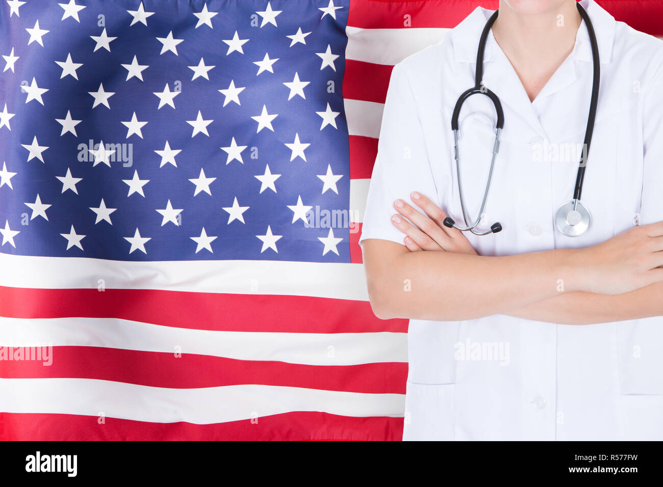 Doctor Standing Against USA Flag Stock Photo - Alamy