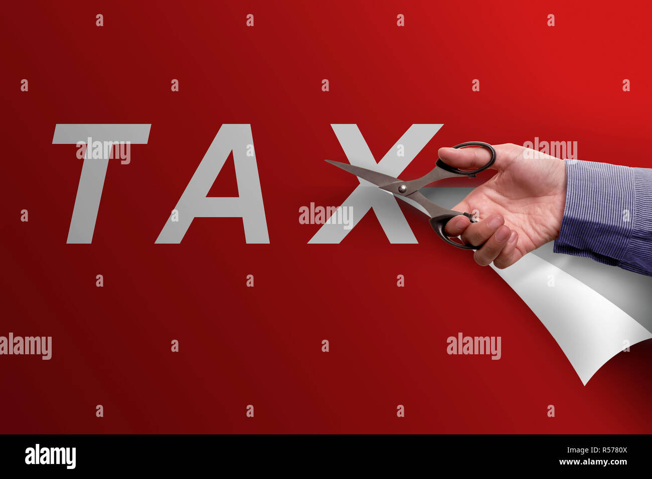 Business hand with scissors cutting Tax word Stock Photo - Alamy