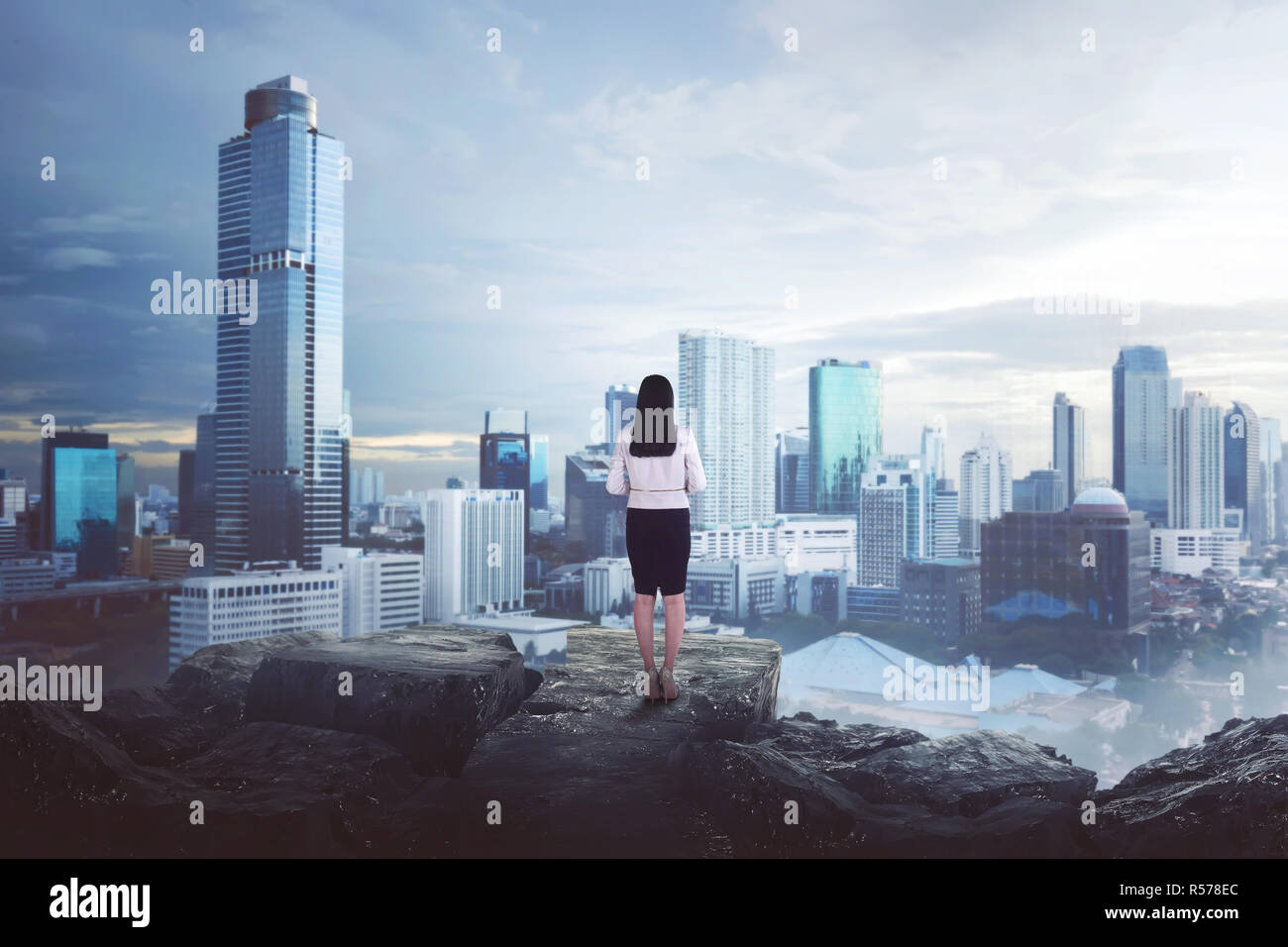 Back view of asian business woman standing looking at the city Stock ...