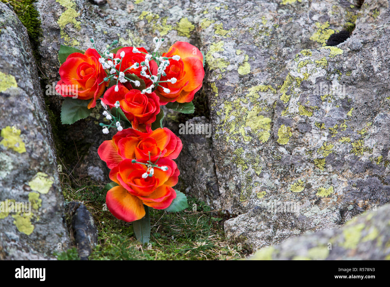 Plastic flower cross on Todd Crag in the Lake District. Not an ...